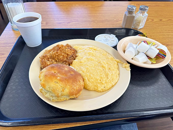 Breakfast heaven on a plate - fluffy eggs, a perfectly crisped chicken drumette, and a biscuit that would make your grandmother both proud and jealous.