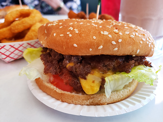 Behold the cheeseburger in its natural habitat&mdash;a sesame-speckled bun housing a generous patty where cheese doesn't just melt, it becomes one with the beef.
