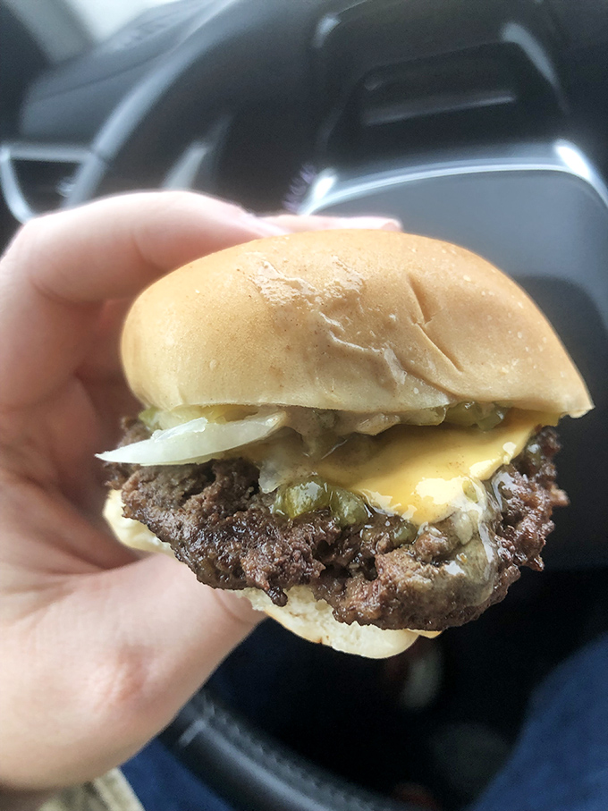 Behold the Crabill's cheeseburger in its natural habitat&mdash;your hand! That melted American cheese creates the perfect bond between beef and bun.