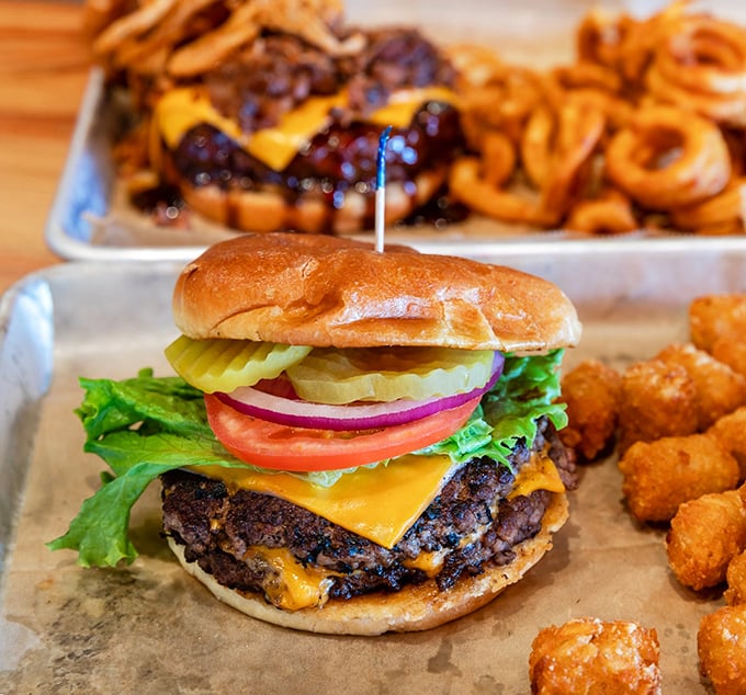 This isn't just a cheeseburger—it's architecture. Notice how the melted cheese cascades perfectly over those caramelized edges.