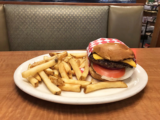 This isn't just a cheeseburger—it's therapy on a plate. The melted cheese cascades down the patty like a yellow waterfall of joy.