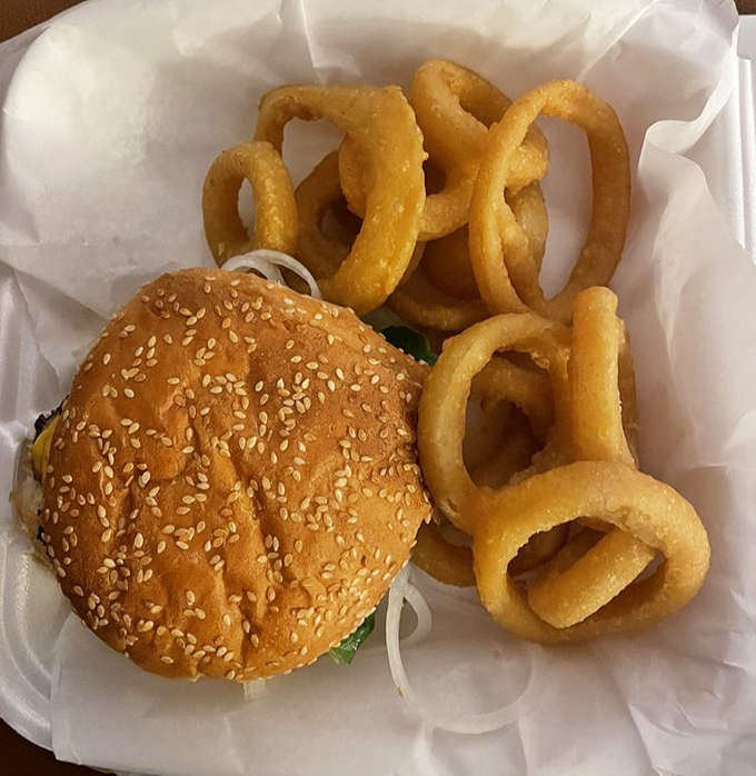 This isn't just a burger&mdash;it's therapy on a sesame seed bun, with golden onion rings that crunch loud enough to turn heads.