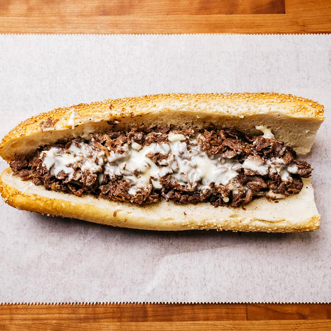 The classic cheesesteak gets the Ochinilis treatment &ndash; perfectly melted cheese cascading over tender, seasoned beef perfection.