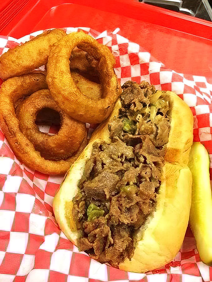 This isn't just a sandwich&mdash;it's a masterpiece of meat and melted cheese escorted by golden onion rings that deserve their own standing ovation.