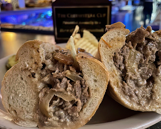 A proper cheesesteak should require a slight forward lean when eating—what locals call the "Philadelphia Posture"—to avoid wearing half your sandwich home.