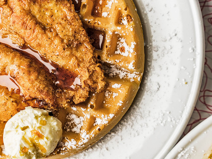 The holy matrimony of crispy fried chicken and fluffy waffles, baptized in maple syrup and topped with a dollop of heavenly butter.