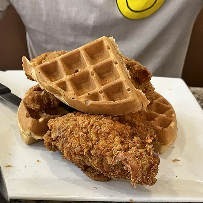 Chicken and waffles: where breakfast and dinner collide in a magnificent display of crispy, fluffy, sweet, and savory harmony.