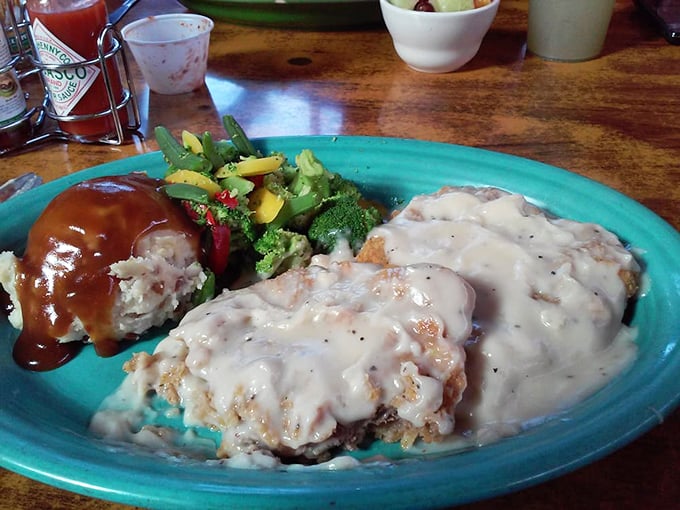 Country fried steak smothered in gravy that could make your grandmother jealous, served with vegetables that actually taste good.