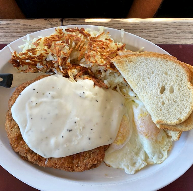 Chicken fried steak with country gravy &ndash; the breakfast equivalent of a warm hug from someone who genuinely wants you to have a good day.