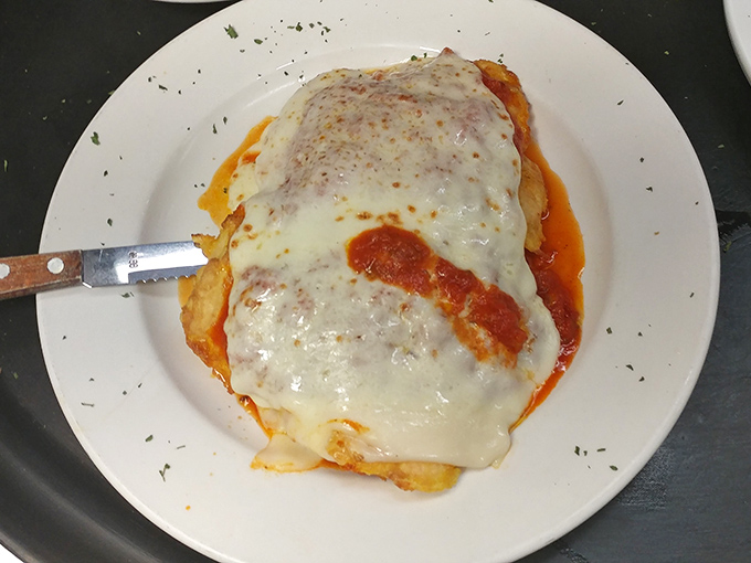 Chicken parmigiana so cheesy it could moonlight as a stand-up comedian. That blanket of melted goodness would make any Italian grandmother nod in approval.
