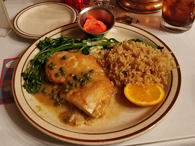 Chicken piccata that would make an Italian grandmother nod in approval, bathed in a buttery caper sauce alongside vibrant broccolini and golden rice.