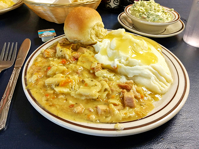 Chicken pot pie that doesn't know it's supposed to fit in a pie shell, instead sprawling gloriously across the plate like it owns the place.