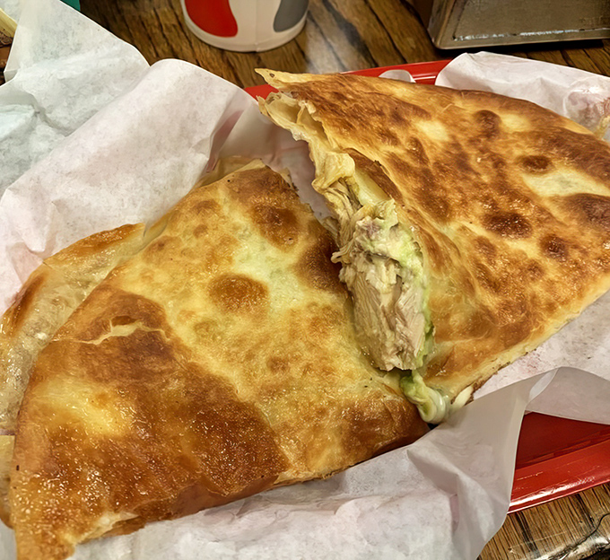Golden-brown and gloriously stuffed, this quesadilla achieves the perfect crisp-to-gooey ratio that has launched a thousand food pilgrimages.
