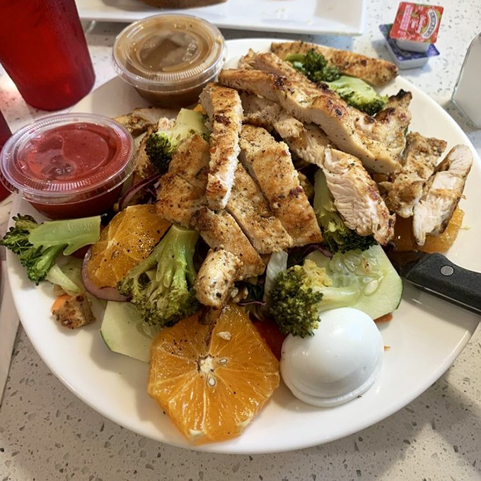 Who knew healthy could look this good? Grilled chicken, fresh oranges, and crisp broccoli create a colorful symphony on a plate.