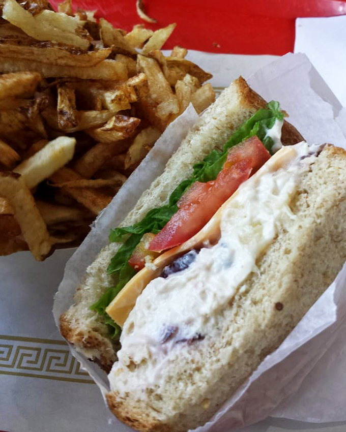 A classic sandwich paired with golden fries&mdash;comfort food that speaks the universal language of "you're going to need extra napkins."