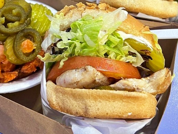 The chicken sandwich comes loaded with crisp veggies and jalapeños – proof that Carney's isn't just a one-trick pony in the burger department.