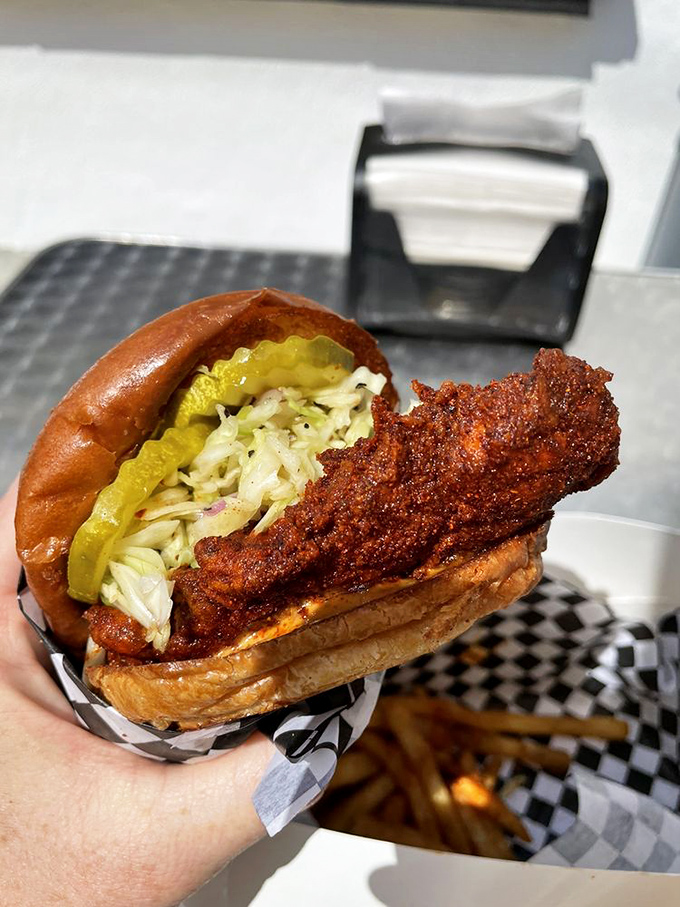 The Humble Melt sandwich, where crispy chicken, tangy slaw, and pickles create the holy trinity of handheld happiness. Worth every napkin.