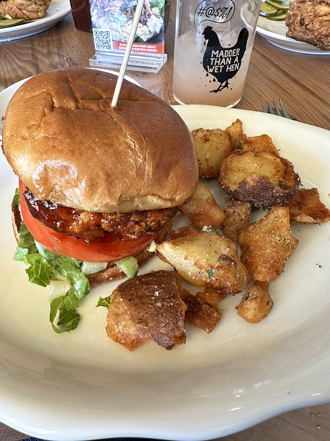 This isn't just a sandwich; it's architecture. A towering testament to the art of comfort food, complete with crispy potatoes that deserve their own fan club. 