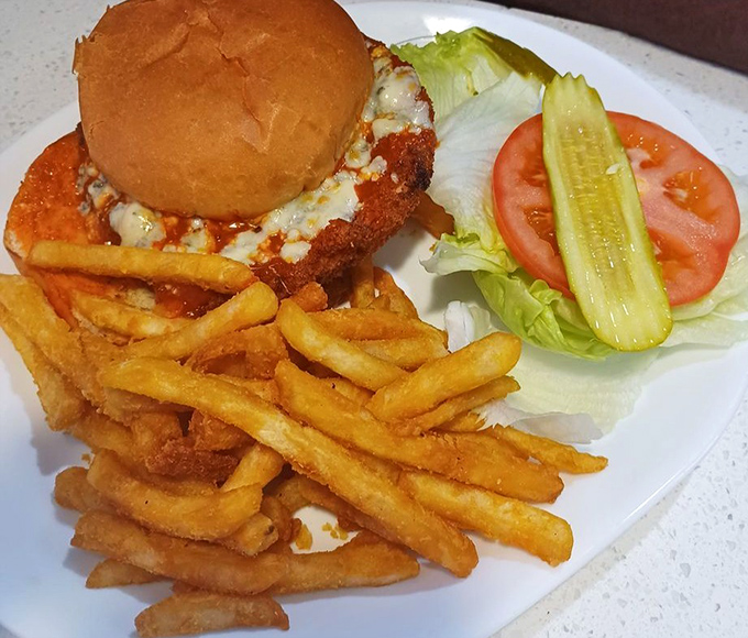 This isn't just a chicken sandwich&mdash;it's architecture. The golden-fried chicken, melty cheese, and crispy fries create the Taj Mahal of lunch options.