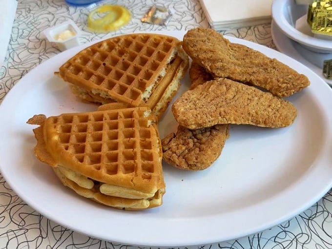 The ultimate breakfast compromise: golden waffles meeting crispy chicken. It's like breakfast and lunch called a truce, and we're all winners.