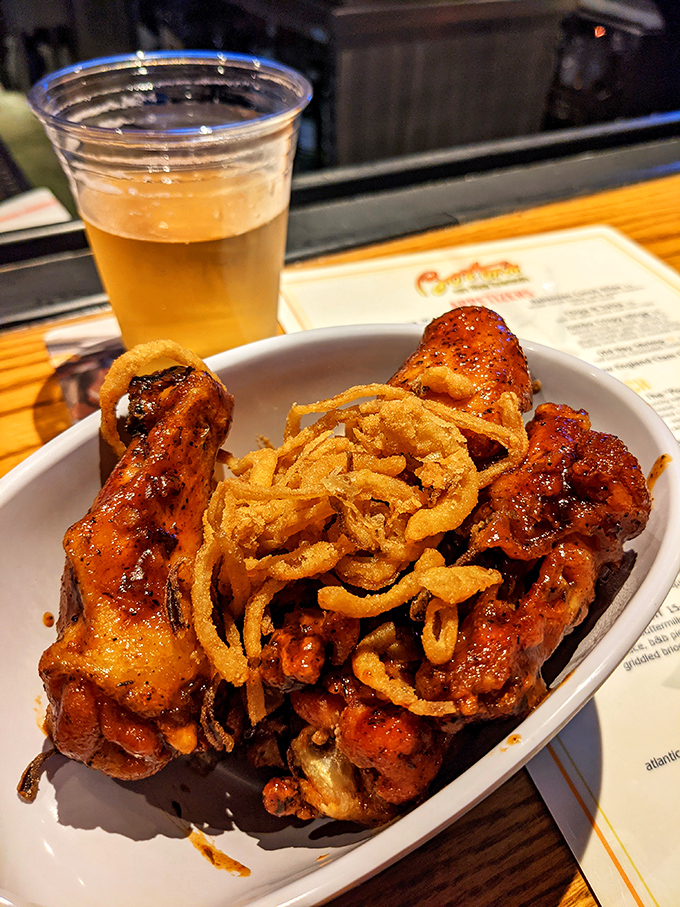 Buffalo wings that don't mess around, topped with crispy onion strings. The perfect companion for screaming at referees on game day.