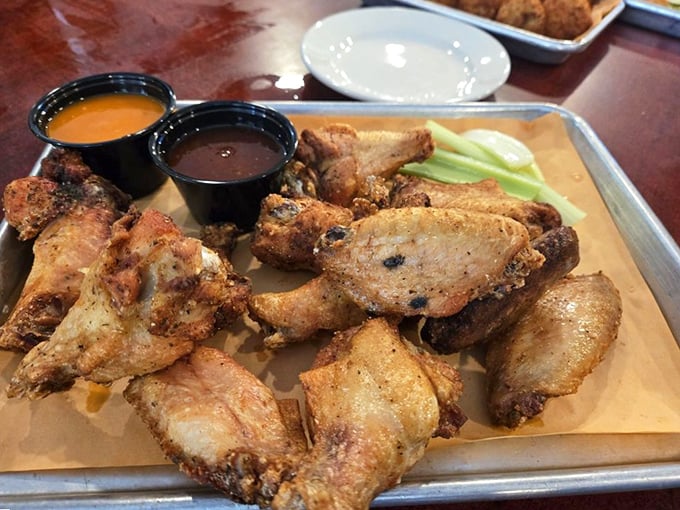 These wings aren't just fried, they're transformed – crispy, golden-brown perfection served with dipping sauces that demand to be explored.