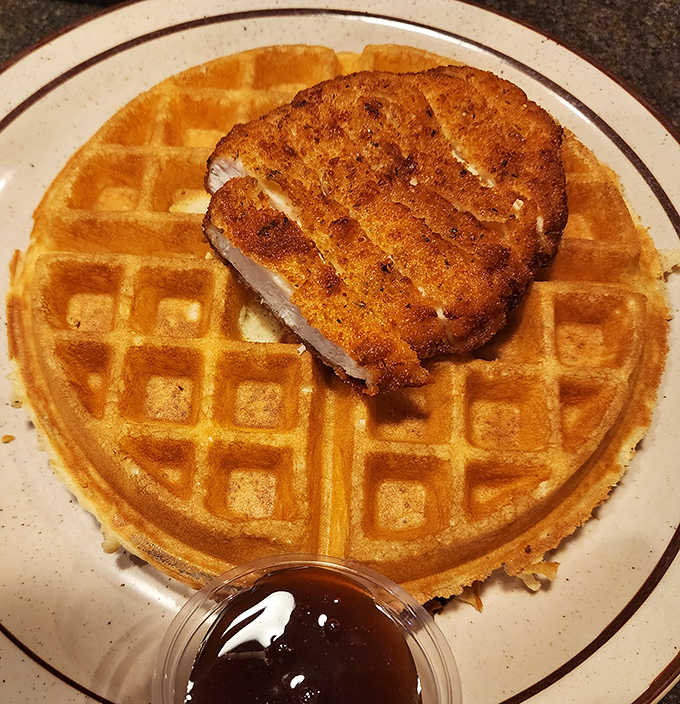 The golden waffle and perfectly crisp chicken create a breakfast power couple more iconic than Sonny and Cher in their heyday.
