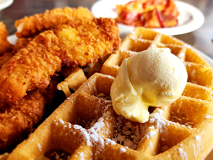 The breakfast equivalent of a standing ovation &ndash; crispy fried chicken perched atop a golden waffle with butter melting into every perfect square.