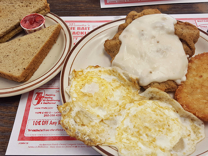 Chicken fried steak swimming in creamy gravy with eggs sunny-side up&mdash;breakfast of champions or the reason for your afternoon nap? Either way, worth it.