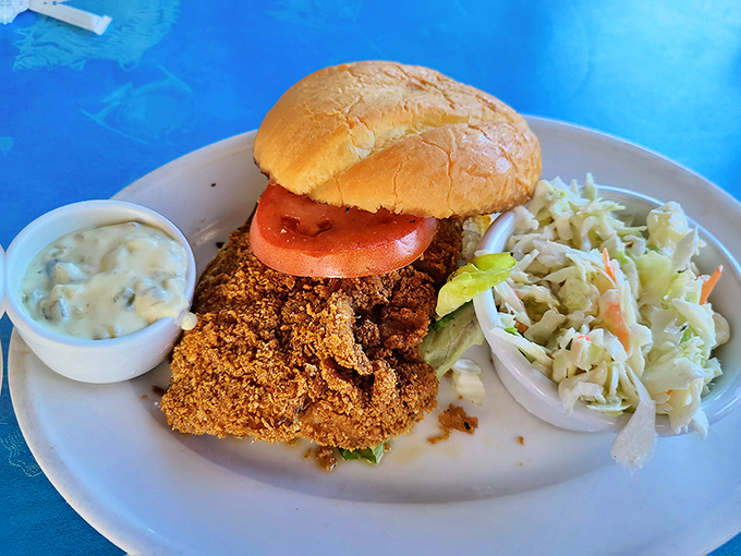 Crunch factor: 100%. This perfectly breaded sandwich brings together crispy coating, juicy chicken, and fresh toppings in a harmony that would make any lunch hour sing.