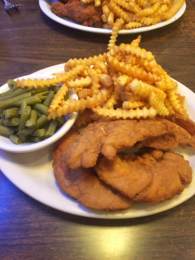 Golden-battered chicken strips that actually taste like chicken&mdash;imagine that! These crispy wonders and crinkle-cut fries could convert any fast-food loyalist.