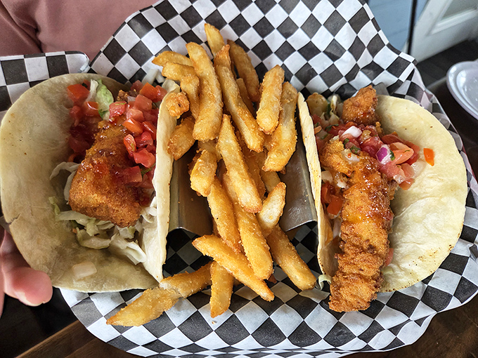 Fish tacos that make Taco Tuesday feel like a celebration. Crispy, fresh, and served with fries that could steal the show if the tacos weren't so perfect.