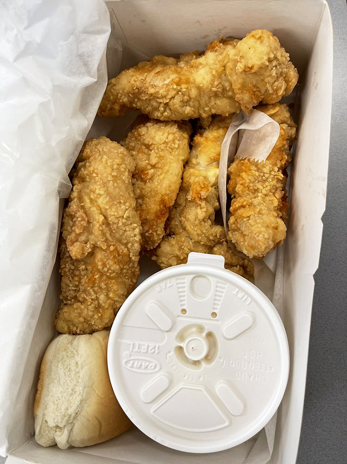 Exhibit A in the case for "Sometimes the simplest pleasures are the best" – tender chicken strips nestled beside fresh bread, waiting for their dipping destiny.