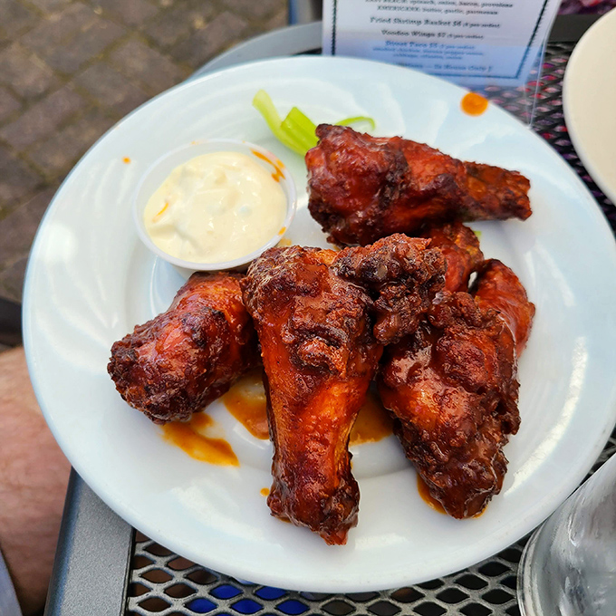 Who knew chicken wings could find such a happy home at a seafood joint? Crispy, saucy, and demanding to be devoured.