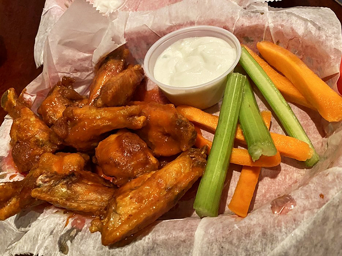 Wings that don't need a runway to take flight. Served with the traditional cooling agents of celery and carrots—nature's edible napkins.