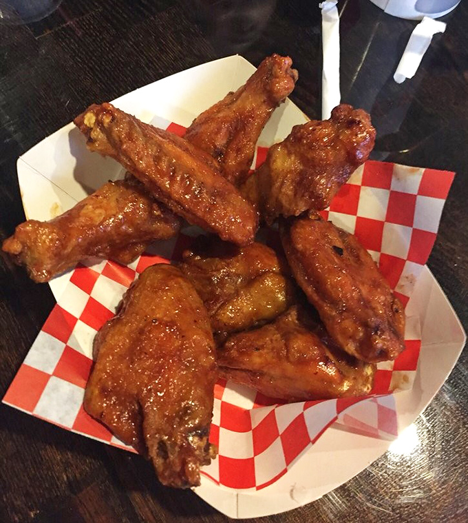 These aren't your average wings. Glistening with sauce and sporting a perfect char, they're what buffalo wings dream of becoming when they grow up.