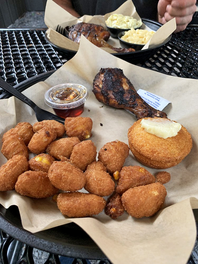 Chicken with perfect bark alongside golden corn fritters&mdash;proof that side dishes deserve their moment in the spotlight too.