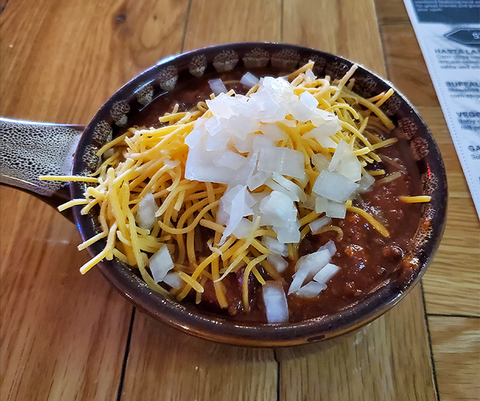 Winter blues, meet your match! This bowl of homemade chili, topped with cheese and onions, is Columbus's version of edible central heating.
