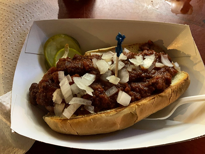 The chili dog comes topped with enough diced onions to ward off vampires for weeks. Worth every breath mint afterward. 
