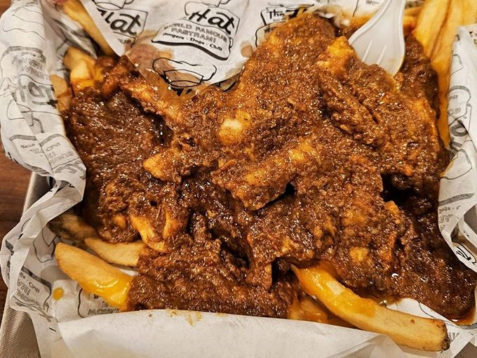 Chili cheese fries that could feed a small nation. The Hat doesn't believe in reasonable portions, and we're all better for it.