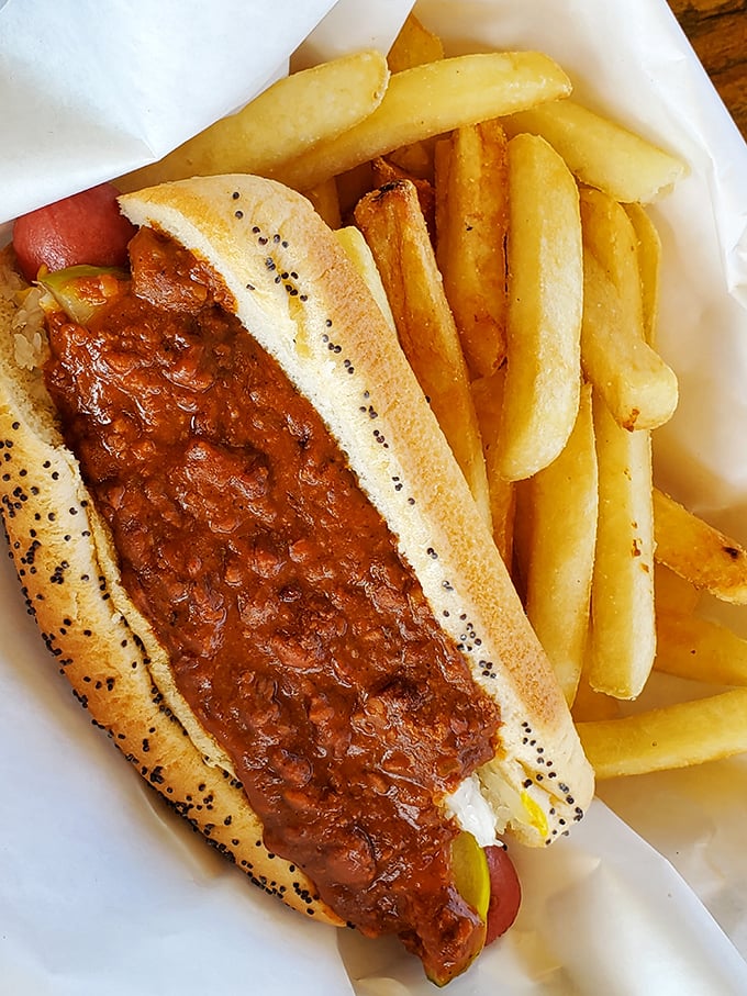 A perfect marriage: the chili dog nestled beside golden fries. Some relationships are complicated; this one is simply delicious.