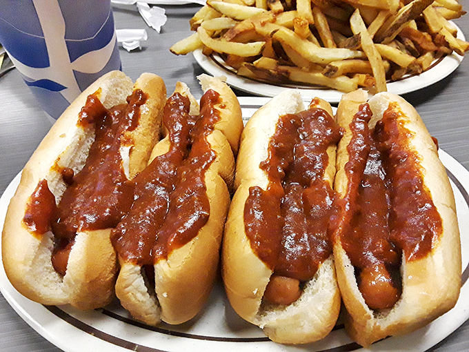 These chili dogs aren't just lunch &ndash; they're edible nostalgia, slathered in that signature sauce that's worth every napkin you'll need afterward.
