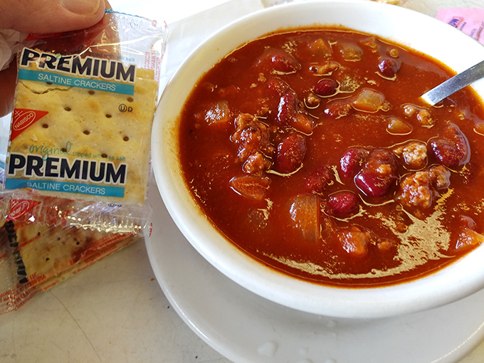 Chili that doesn't need a fancy pedigree to warm your soul, served with crackers that have been doing their job since Roosevelt was president.
