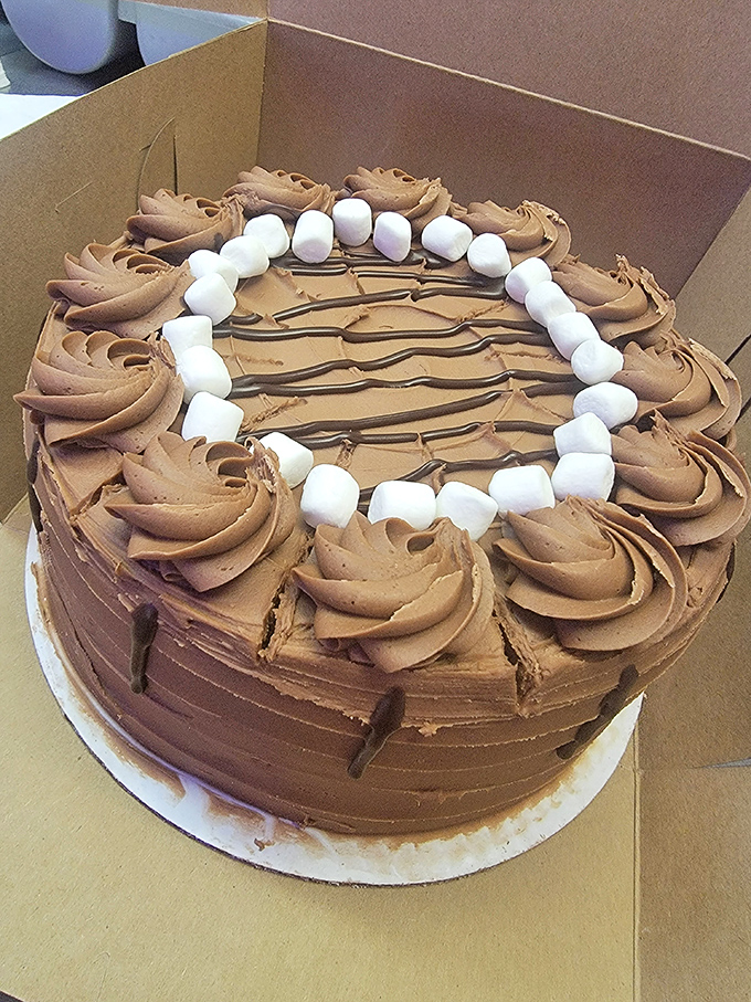 This chocolate masterpiece with marshmallows looks like childhood dreams made edible and absolutely irresistible.