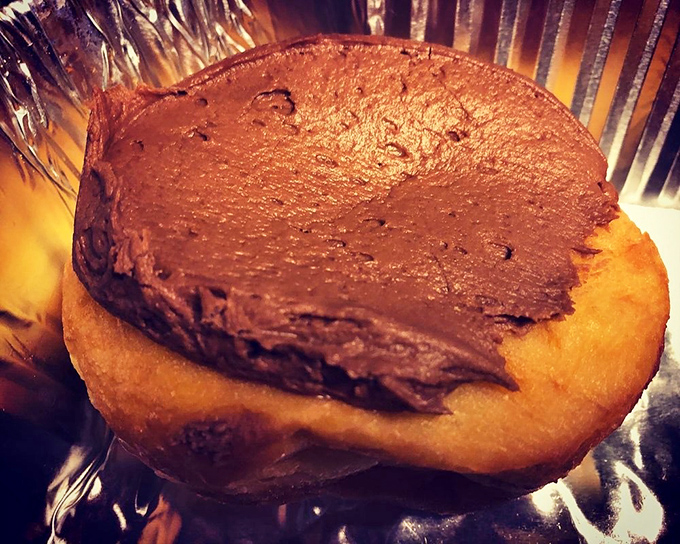 The perfect chocolate-to-donut ratio that would make Willy Wonka himself nod in approval. That bite mark tells the whole story.