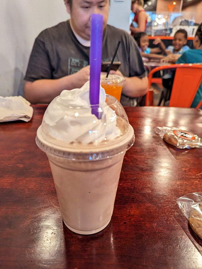 This isn't just a milkshake&mdash;it's dessert with a straw. The purple straw is your ticket to creamy bliss.