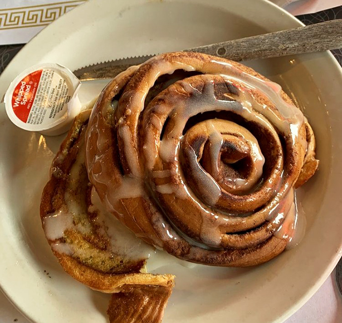 This isn't just a cinnamon roll &ndash; it's a spiral-shaped love letter to your taste buds, glazed with the kind of sweetness that makes Monday bearable.