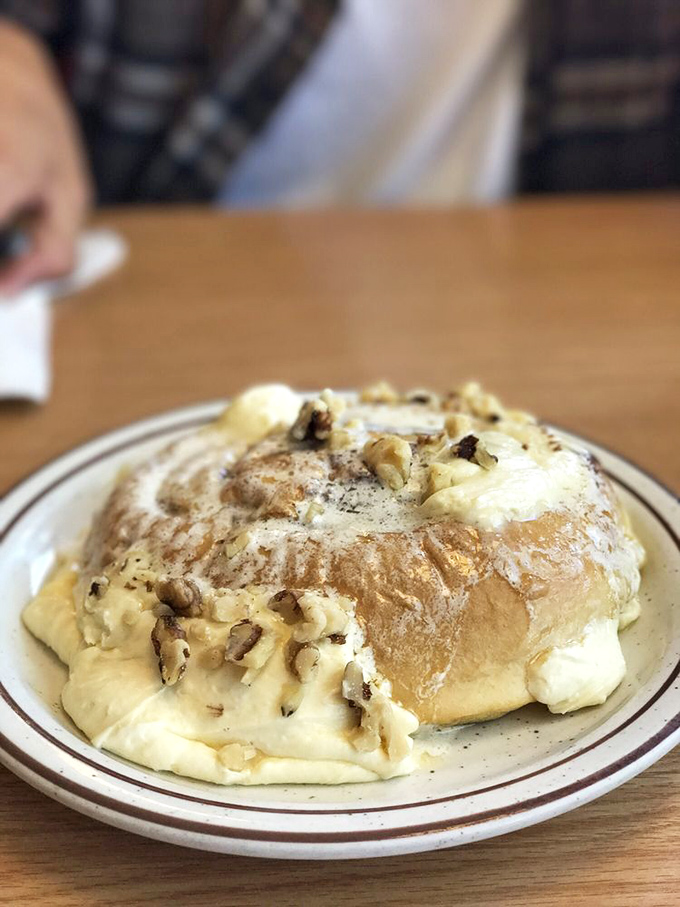 This isn't just a cinnamon roll &ndash; it's a fluffy cloud of dough crowned with melting butter, cinnamon, and walnuts that would make your grandmother weep with joy.