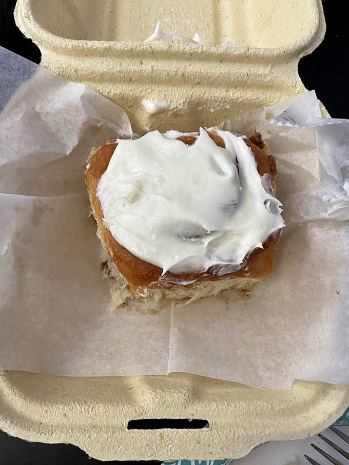 This isn't just a cinnamon roll; it's a cloud of dough wearing a cream cheese halo. Calories? Worth every single one.