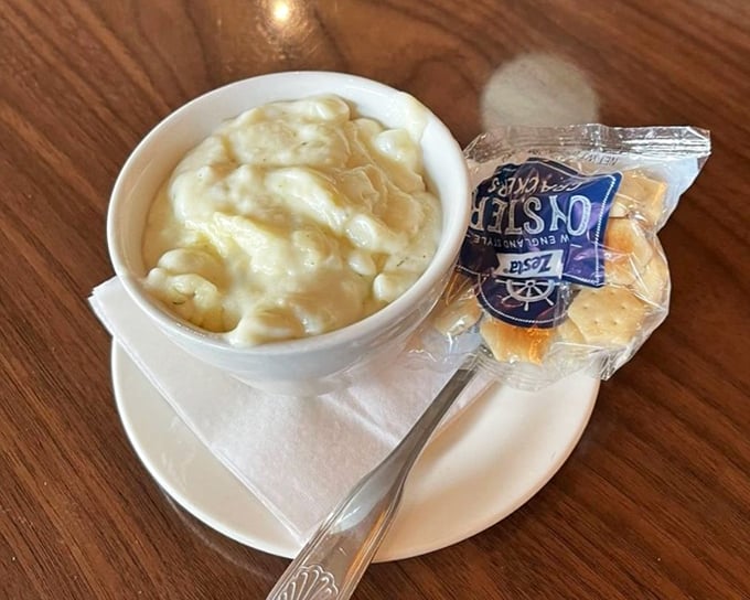Creamy clam chowder so rich it practically hugs your spoon, served with oyster crackers that eagerly await their delicious drowning mission.